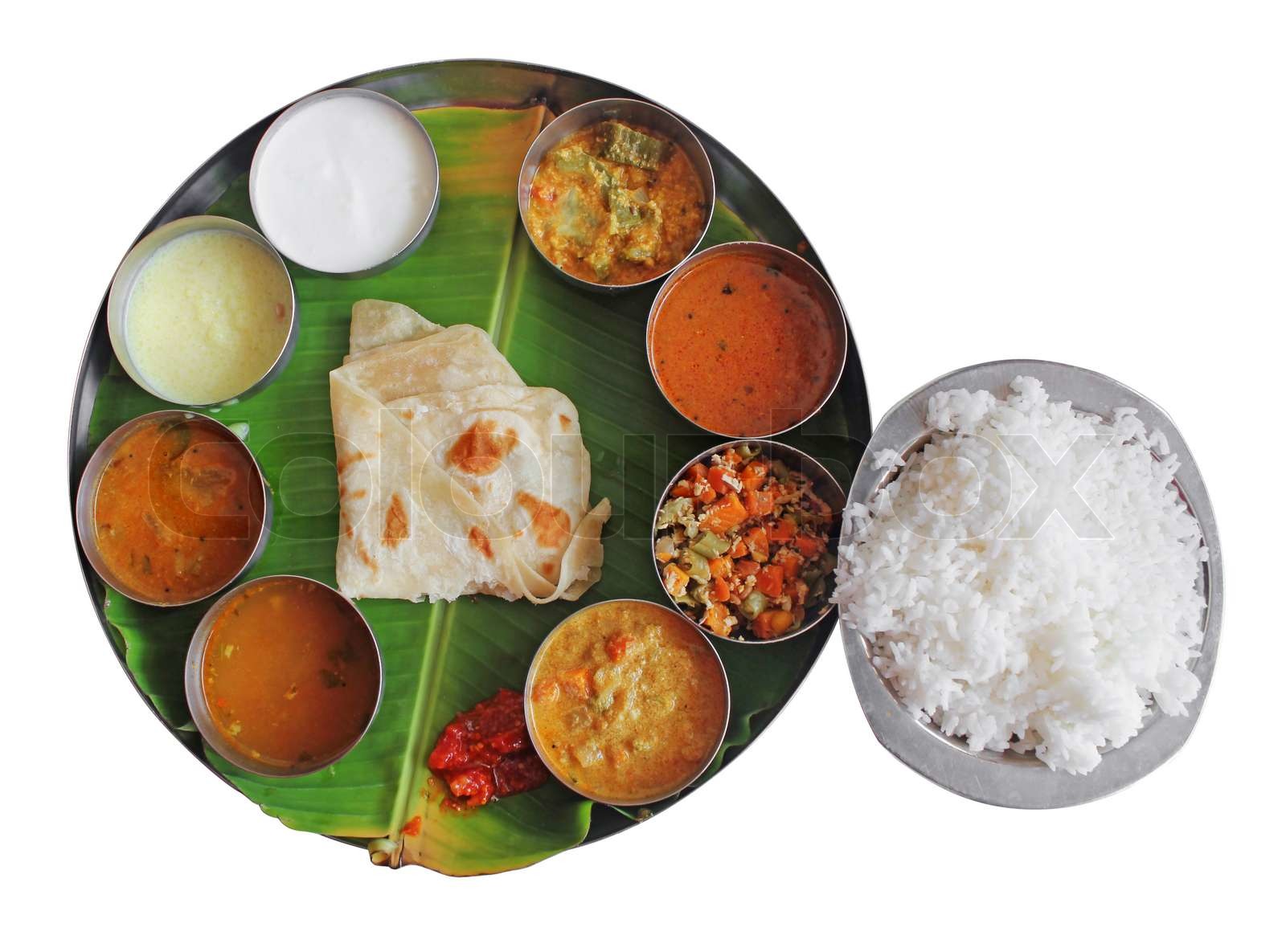 South indian plate meals on banana leaf on white | Stock image | Colourbox