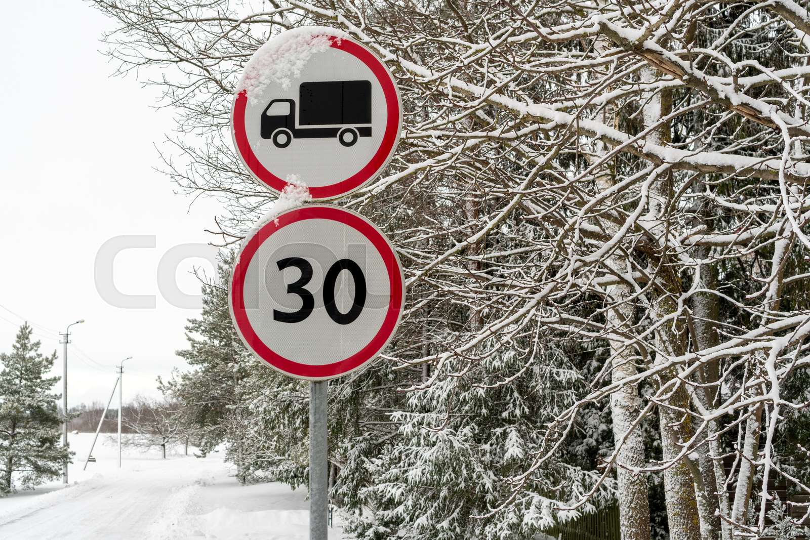Truck prohibited and the speed limit signs | Stock image | Colourbox