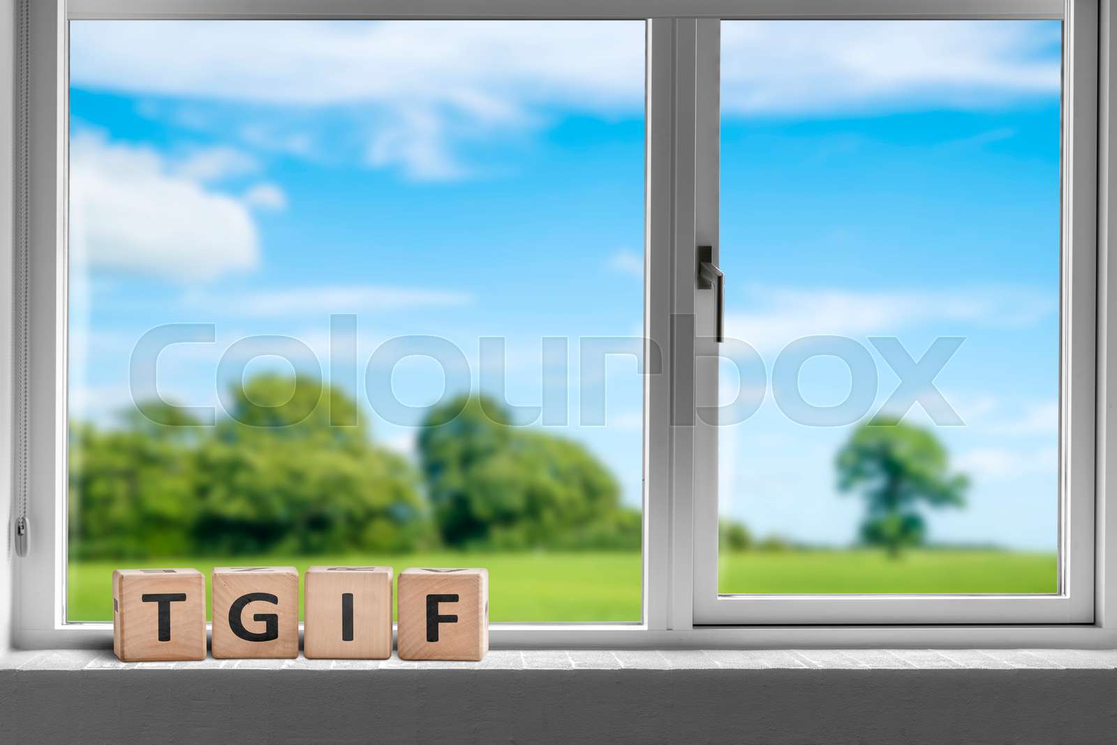 TGIF weekend sign in a white window | Stock image | Colourbox