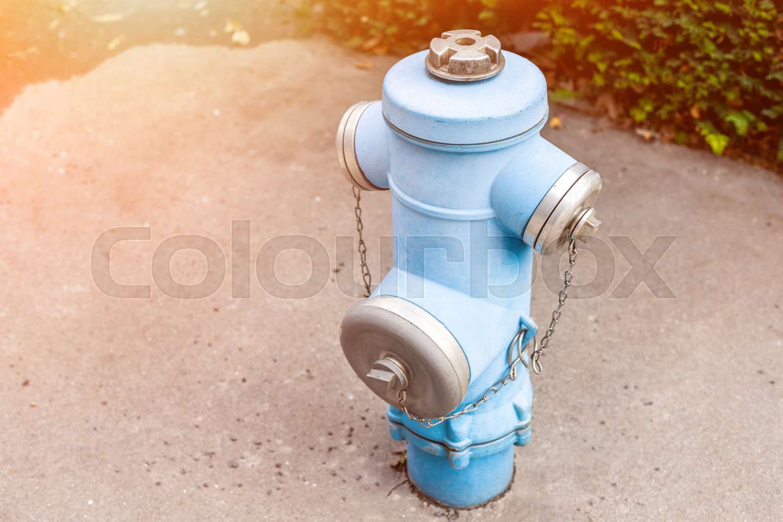 Blue metal vintage fire hydrant on asphalt road at city street | Stock ...