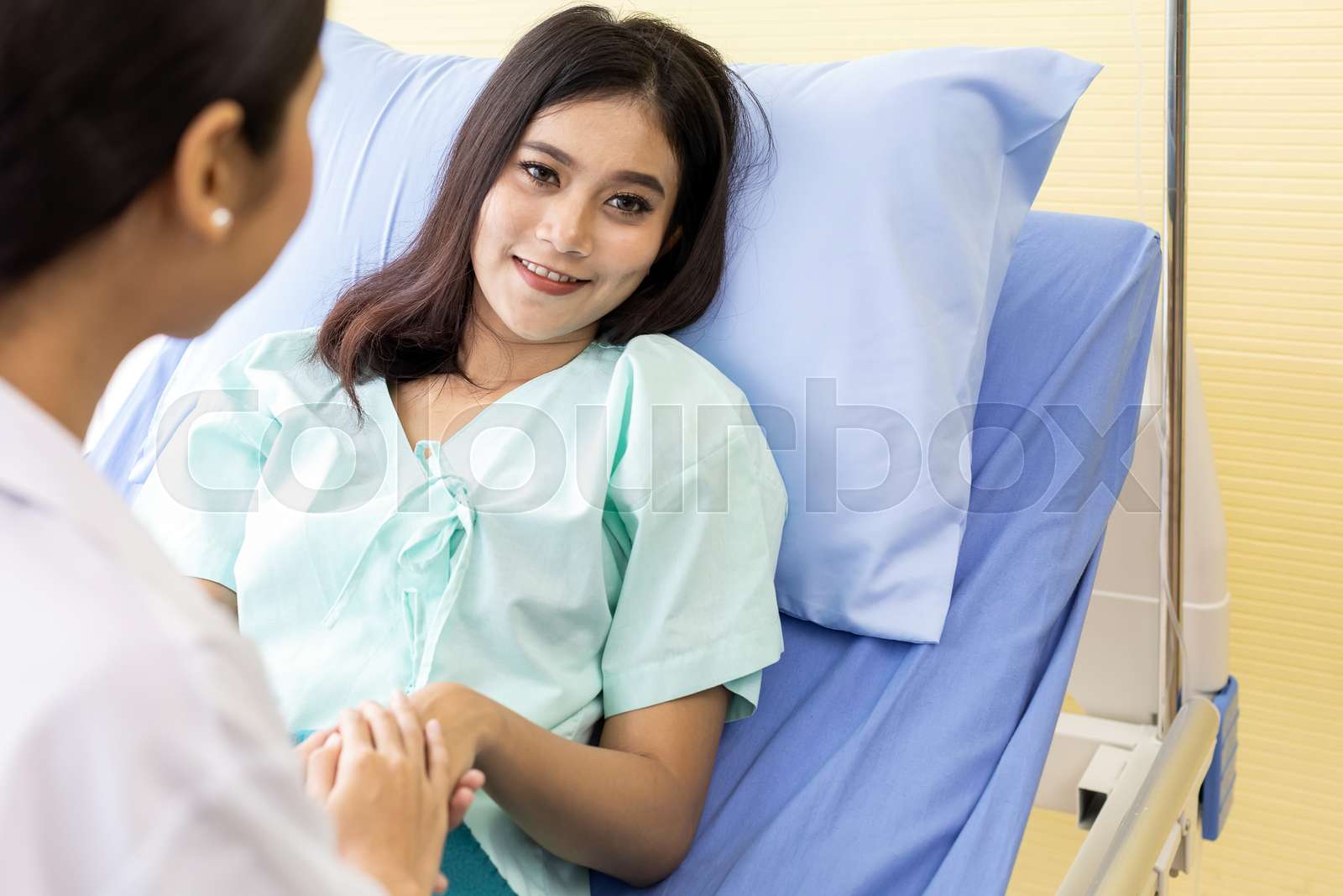medical doctor hold patient hand | Stock image | Colourbox