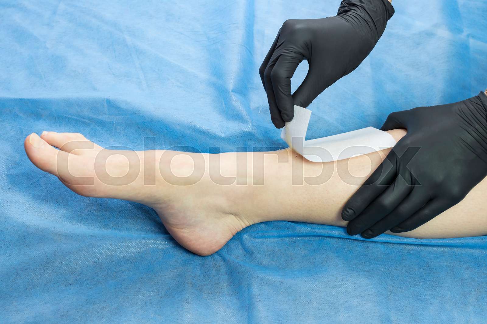 Process depilation female legs and hands in a beauty salon | Stock ...