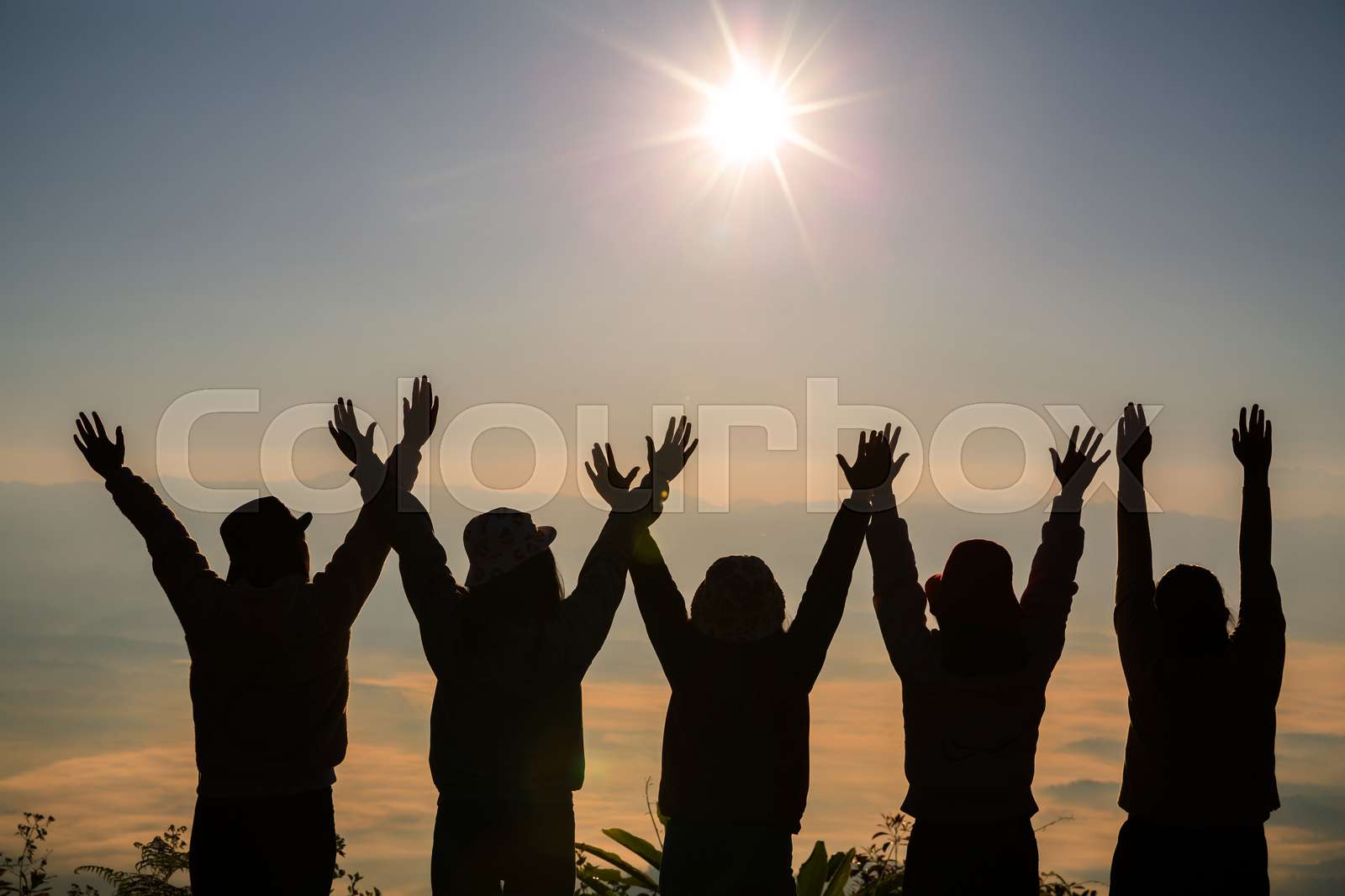 Group of happy people playing at summer sunset in nature | Stock image ...