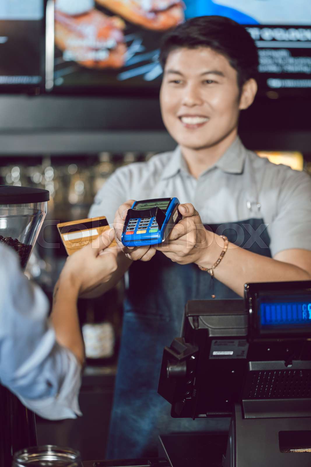 Customer Making Wireless Payment Using Credit Card Stock Image customer-making-wireless-payment-using-credit-card-stock-image