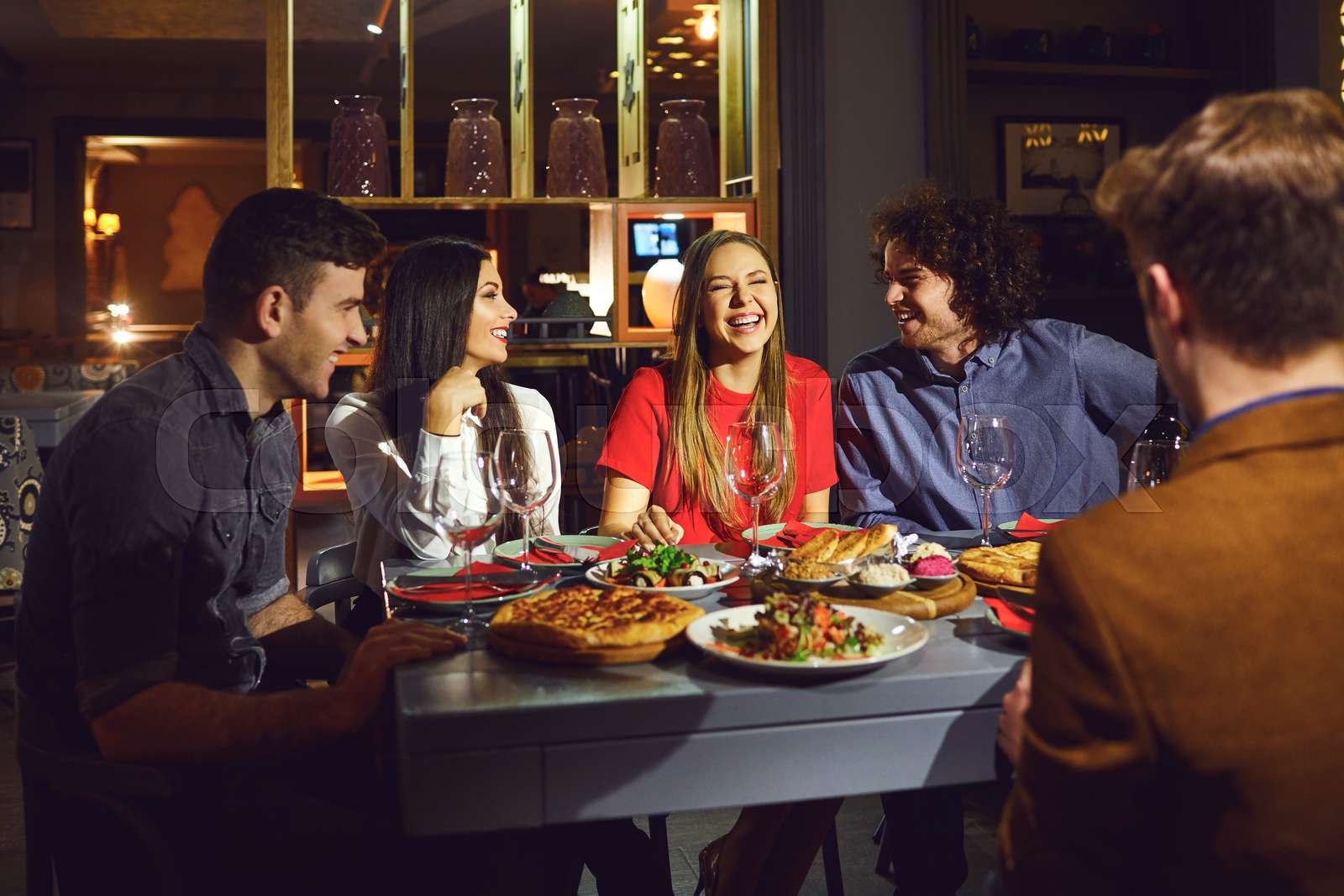 Friends Eating At Restaurant