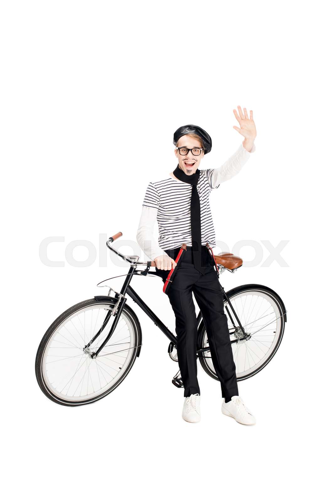 happy french man standing near bicycle and waving hand isolated on ...