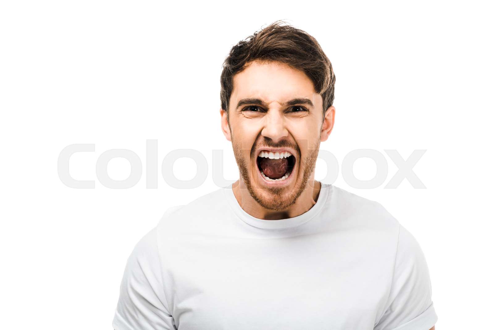 emotional young man screaming and looking at camera isolated on white ...