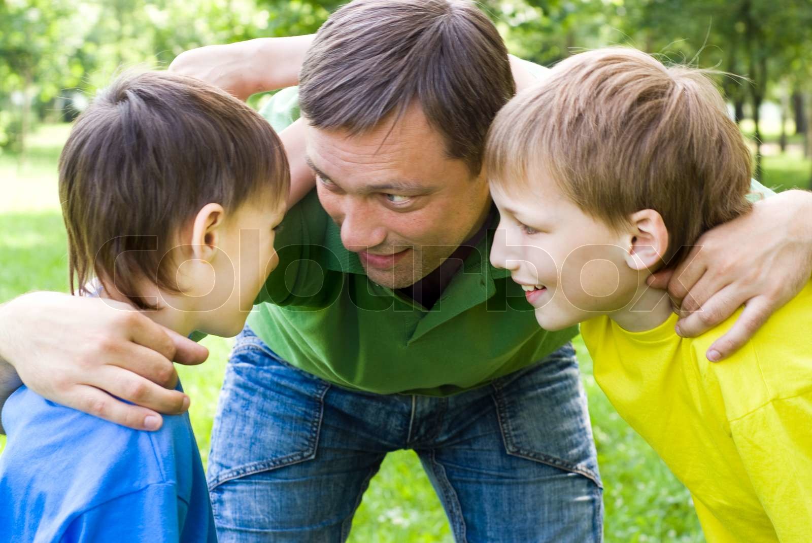 Dad with children outdoors | Stock image | Colourbox