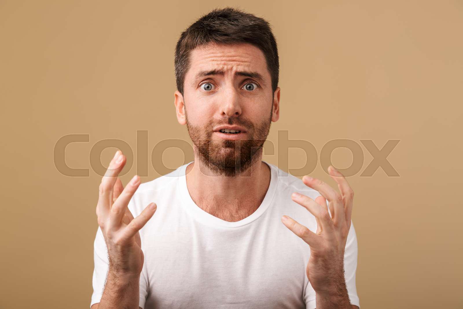 Portrait of a shocked young man casually dressed | Stock image | Colourbox