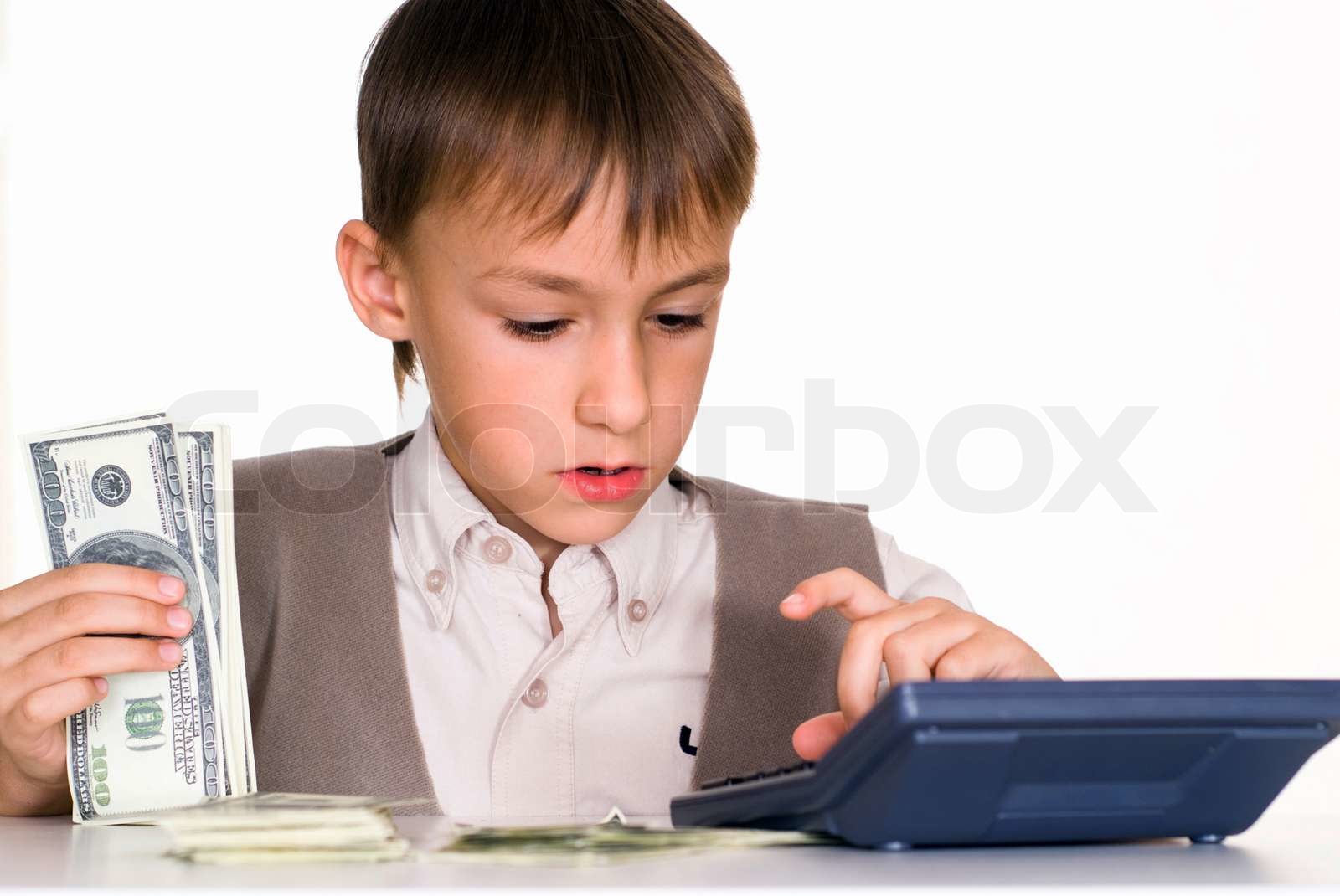 handsome boy finds money | Stock image | Colourbox