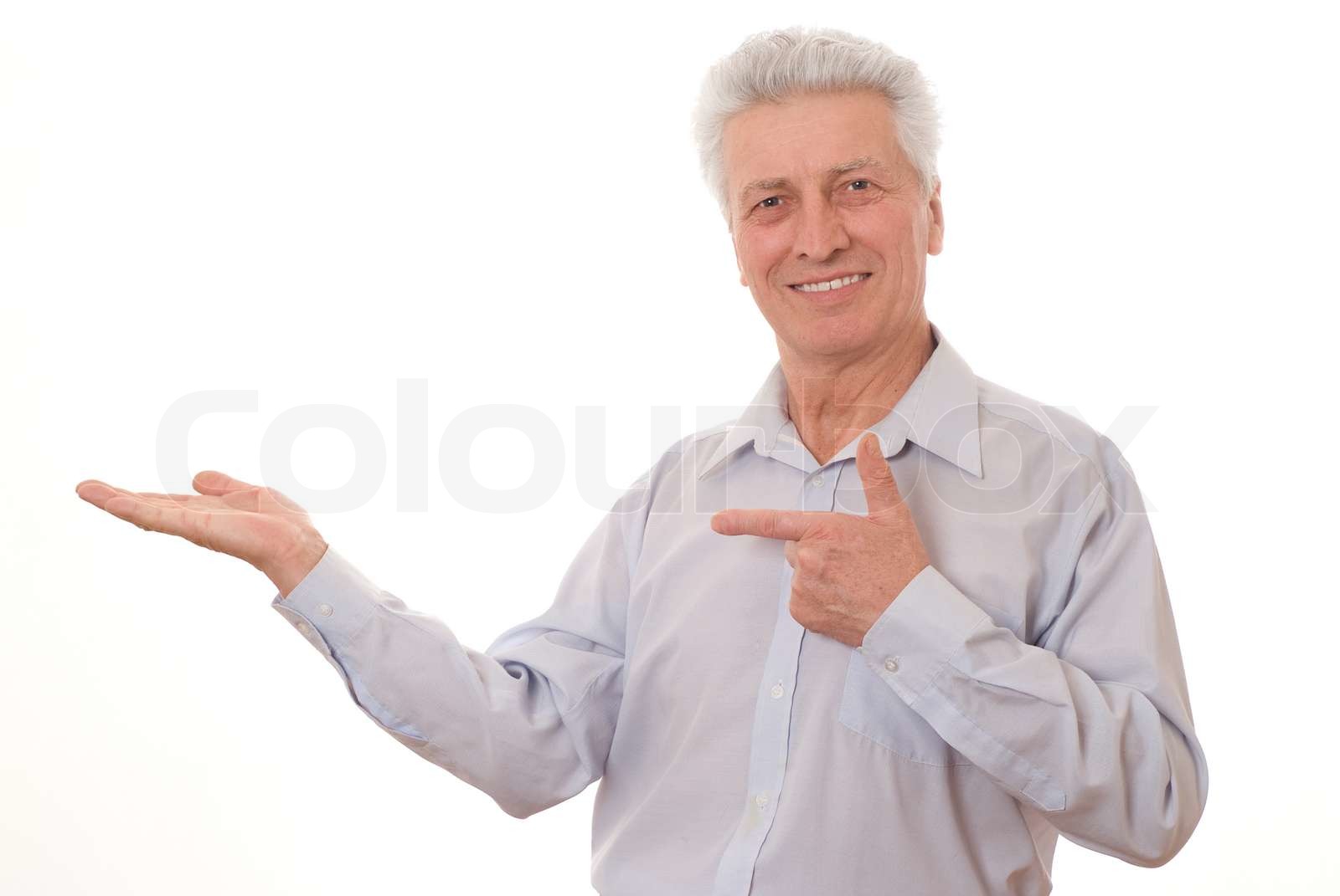 Mature business man holding hand out at copyspace over white background ...