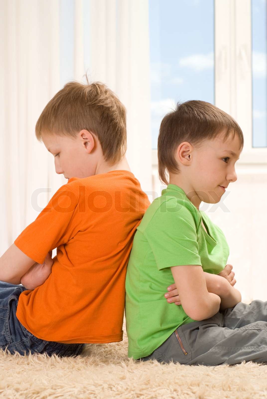petulant children sit together | Stock image | Colourbox