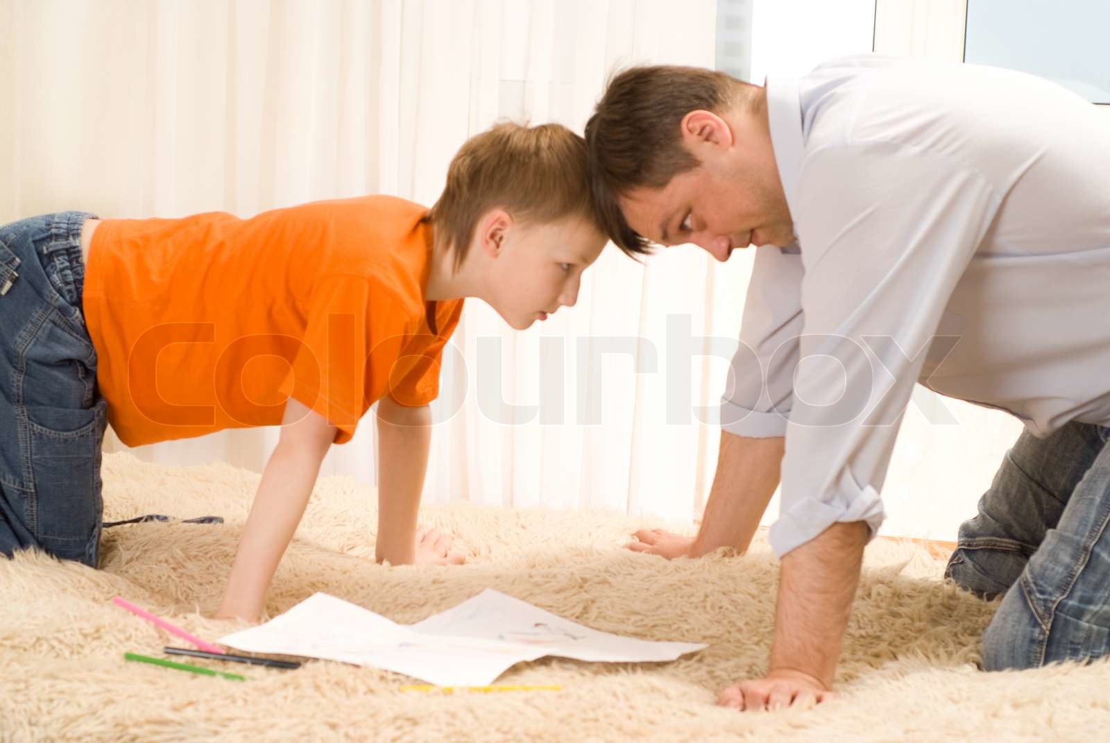 happy father and son struggling | Stock image | Colourbox