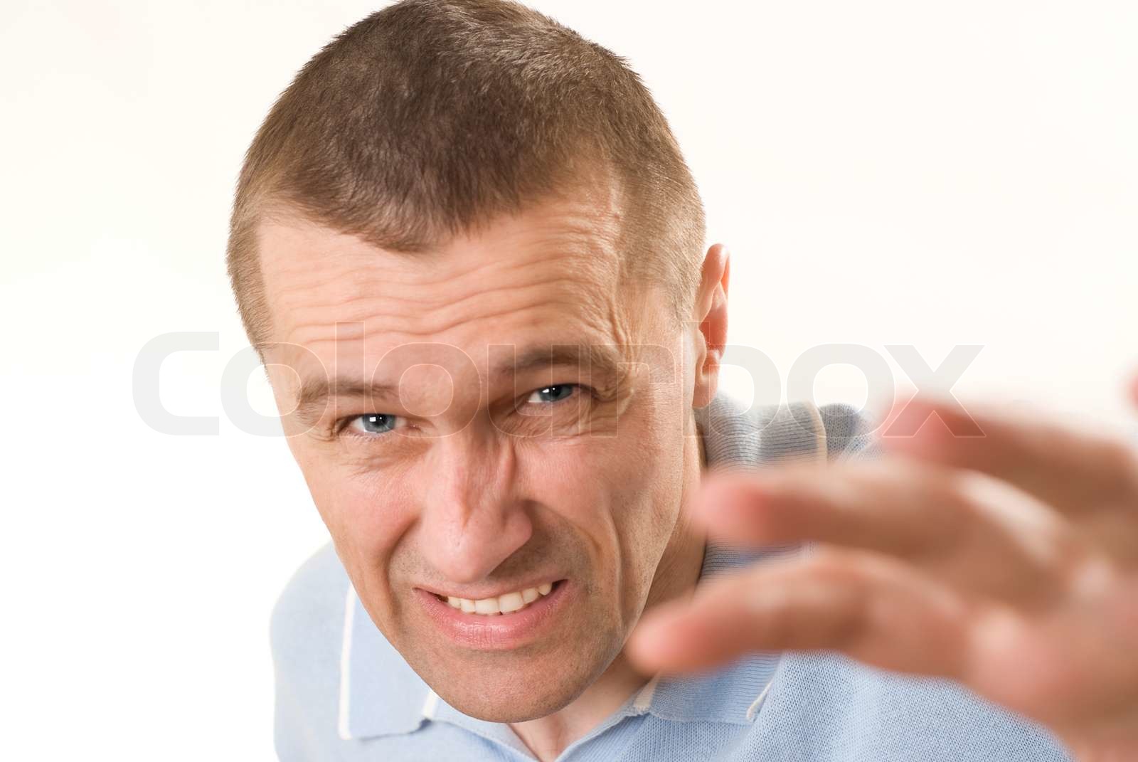 angry man on a white | Stock image | Colourbox