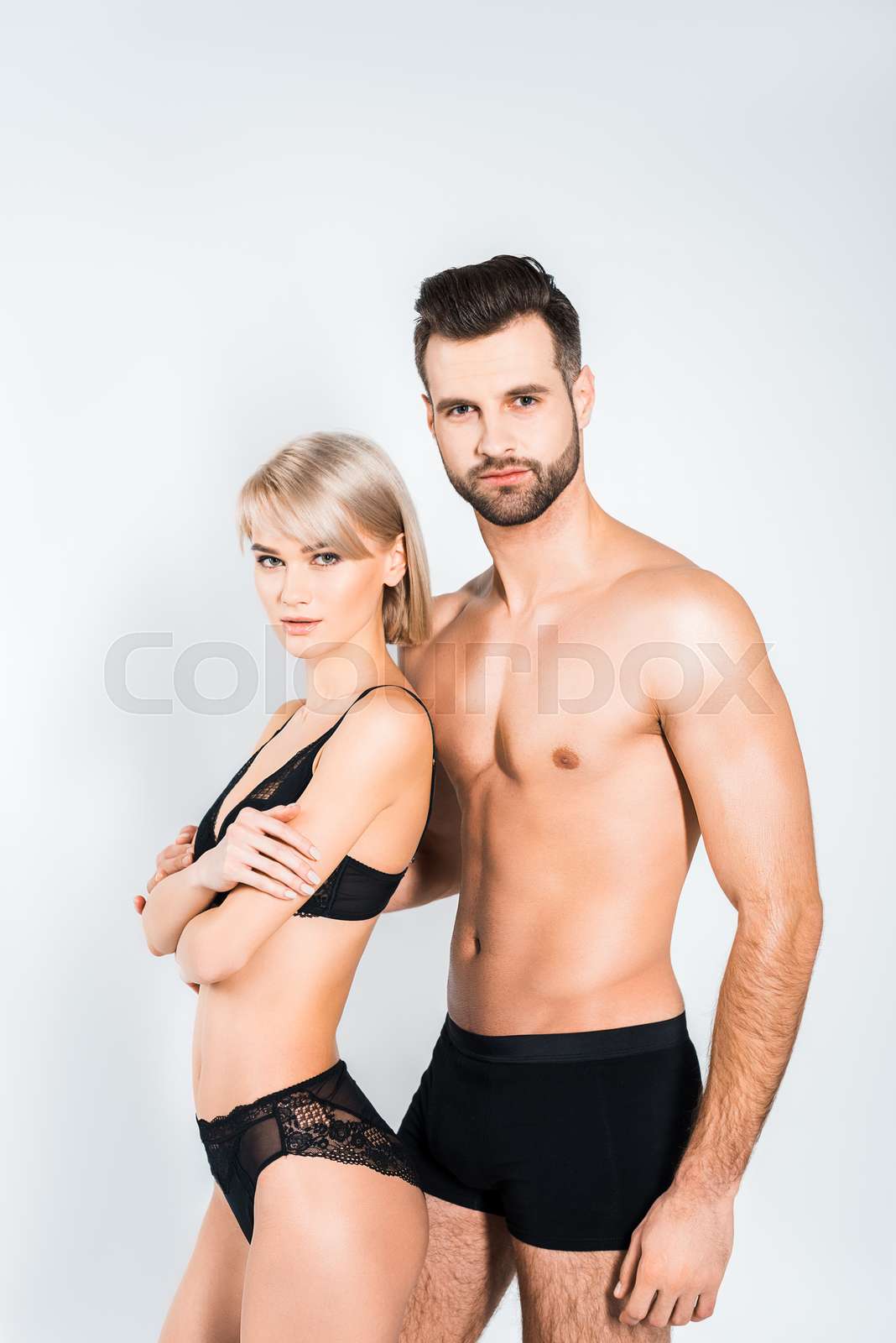 Attractive Couple In Underwear Hugging Isolated On Grey Stock Image Colourbox