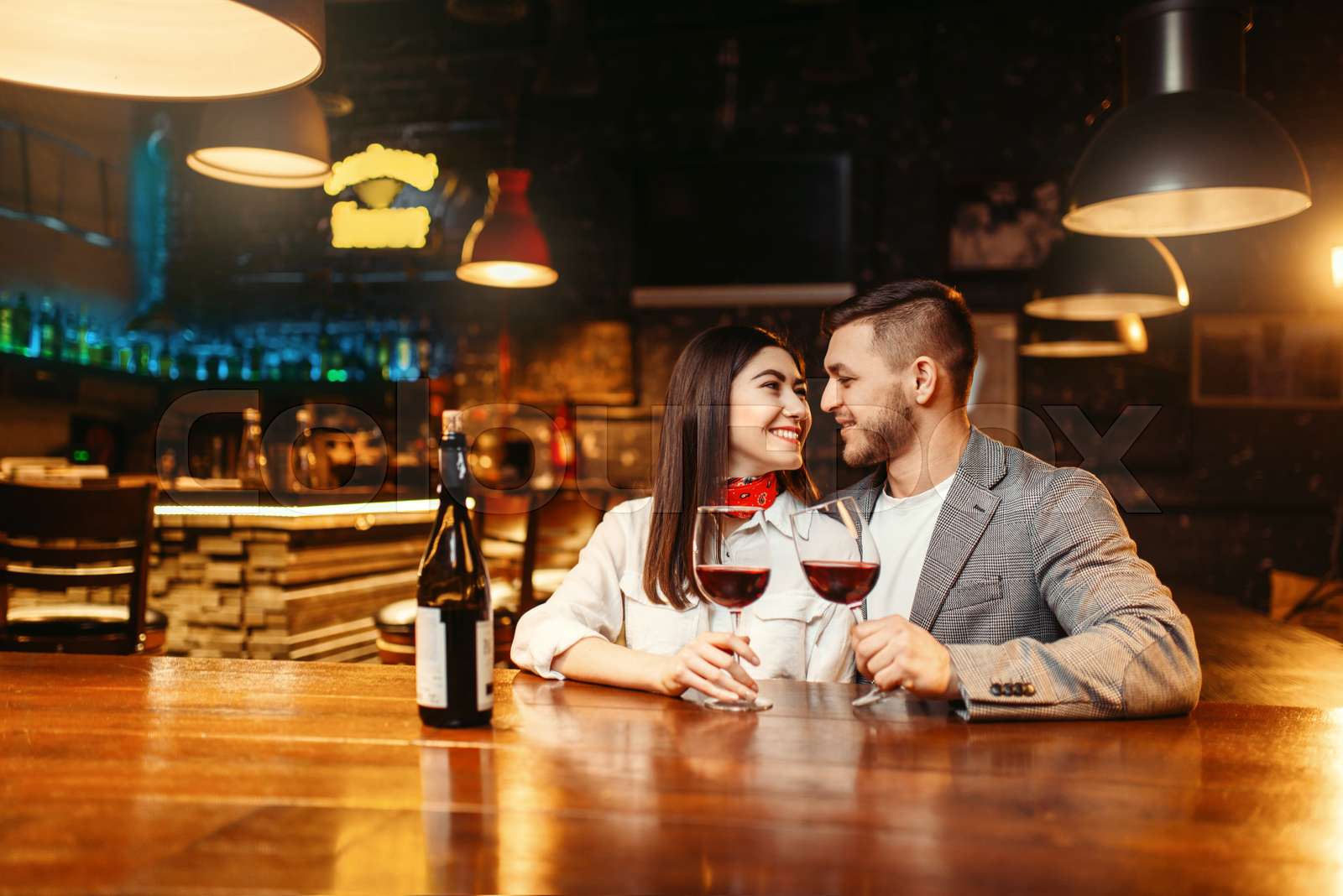 Romantic evening, couple in bar, date celebration | Stock image | Colourbox