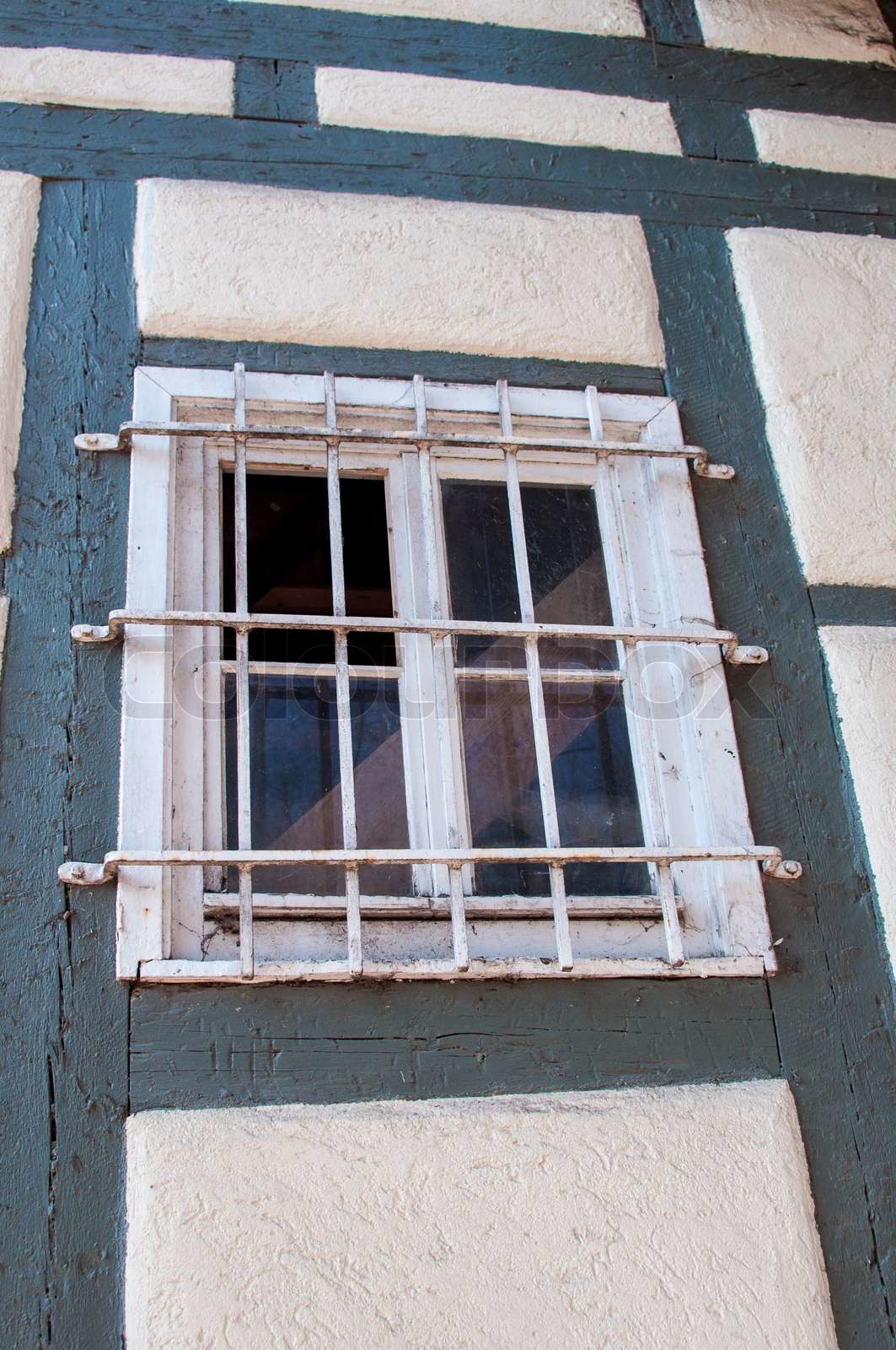Wooden FrameworkAnd Barred Window | Stock image | Colourbox
