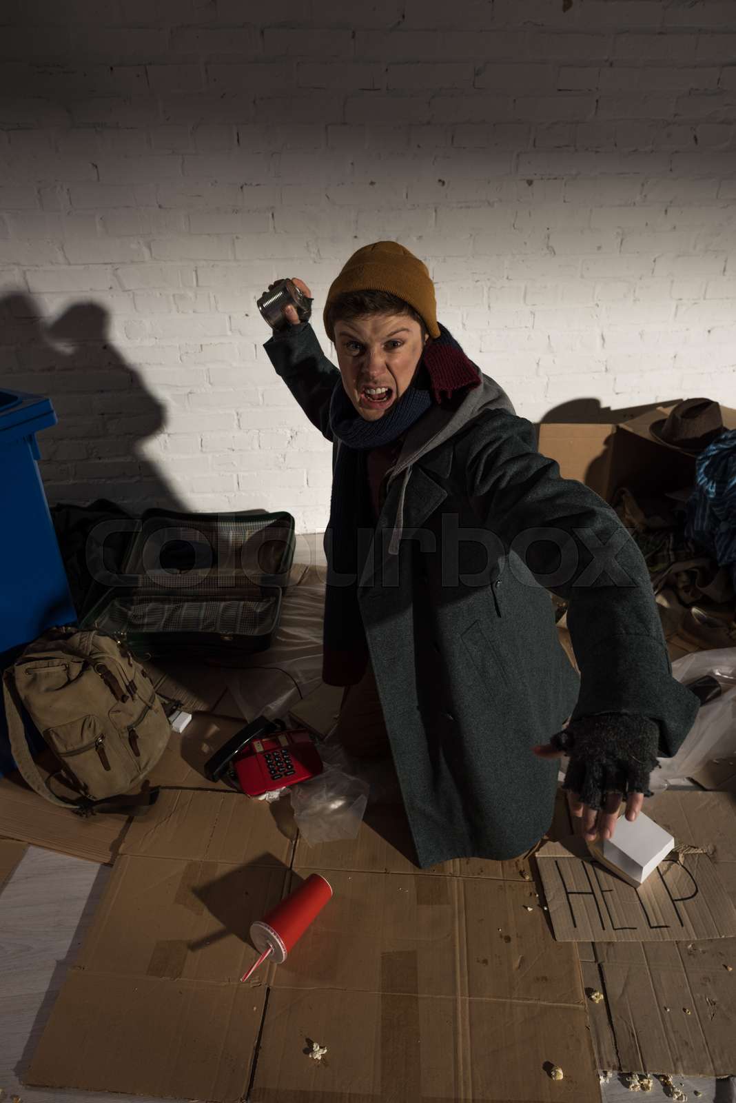 drunk aggressive man screaming while standing on knees in threatening ...