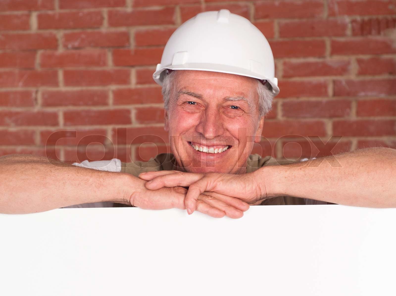 old builder in the helmet | Stock image | Colourbox