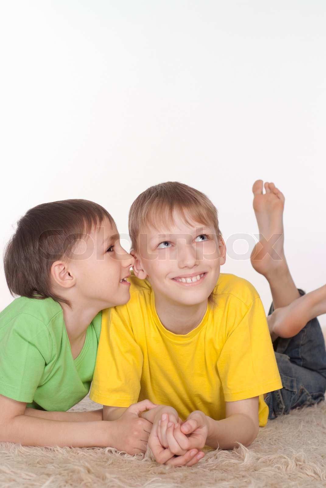 two brothers whispering | Stock image | Colourbox