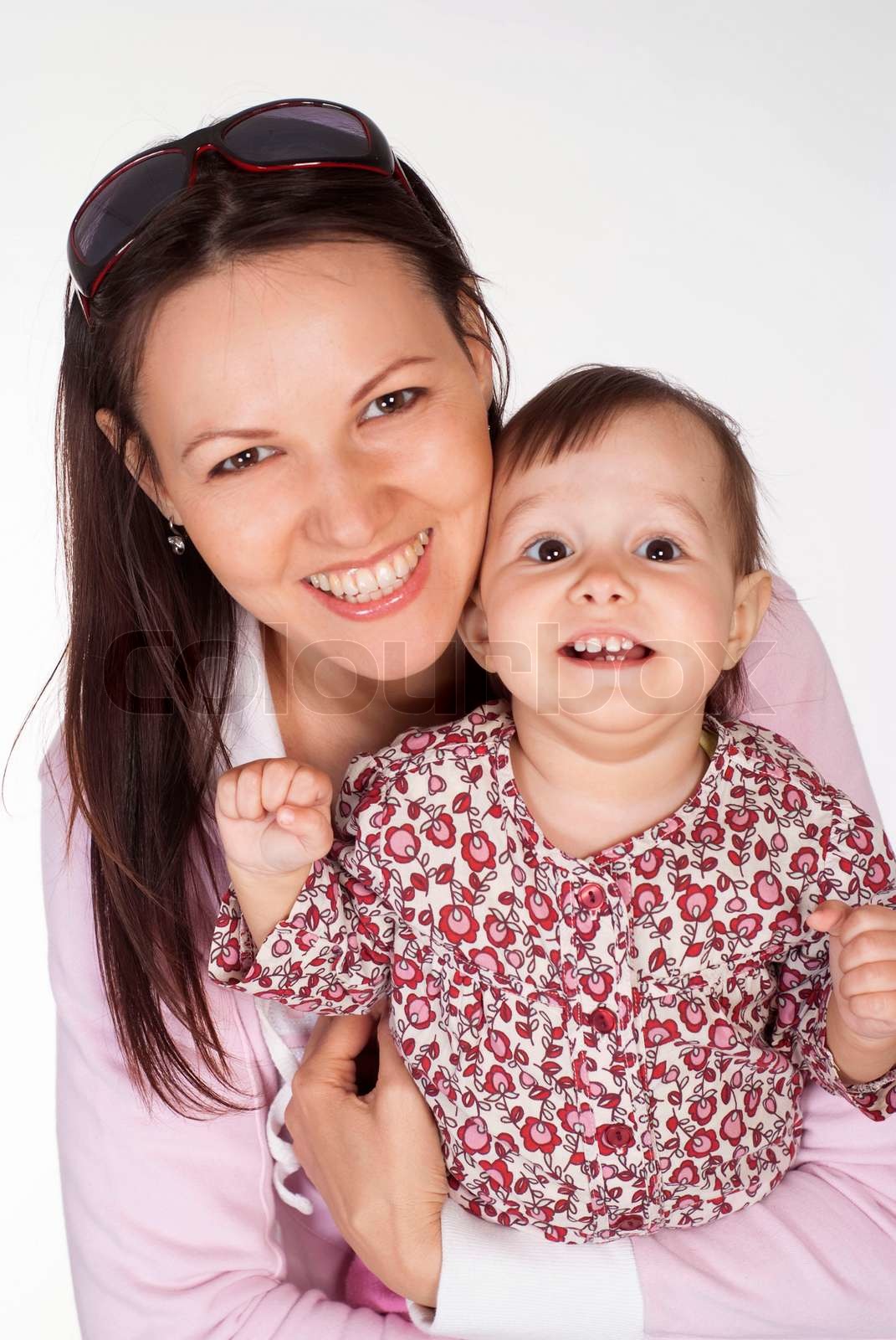 woman with a child on a white | Stock image | Colourbox
