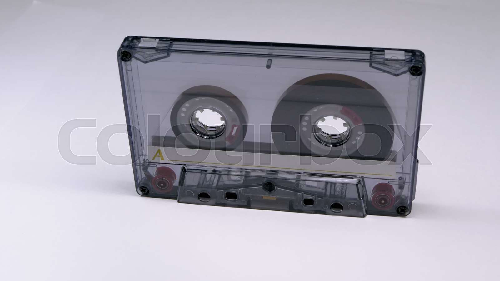 Transparent Audio Cassette Rotates on White Background | Stock video ...