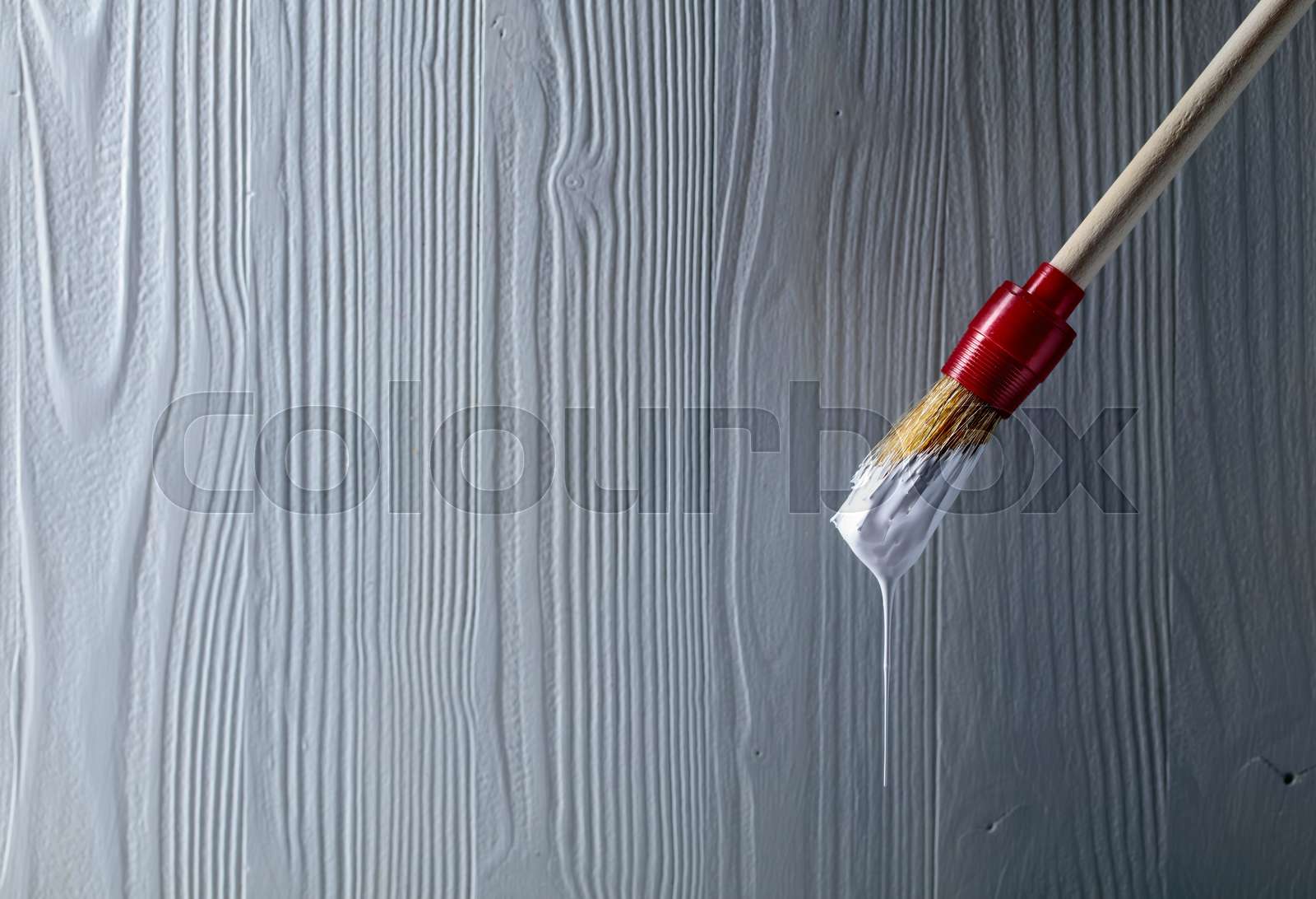 Paintbrush with white paint . | Stock image | Colourbox