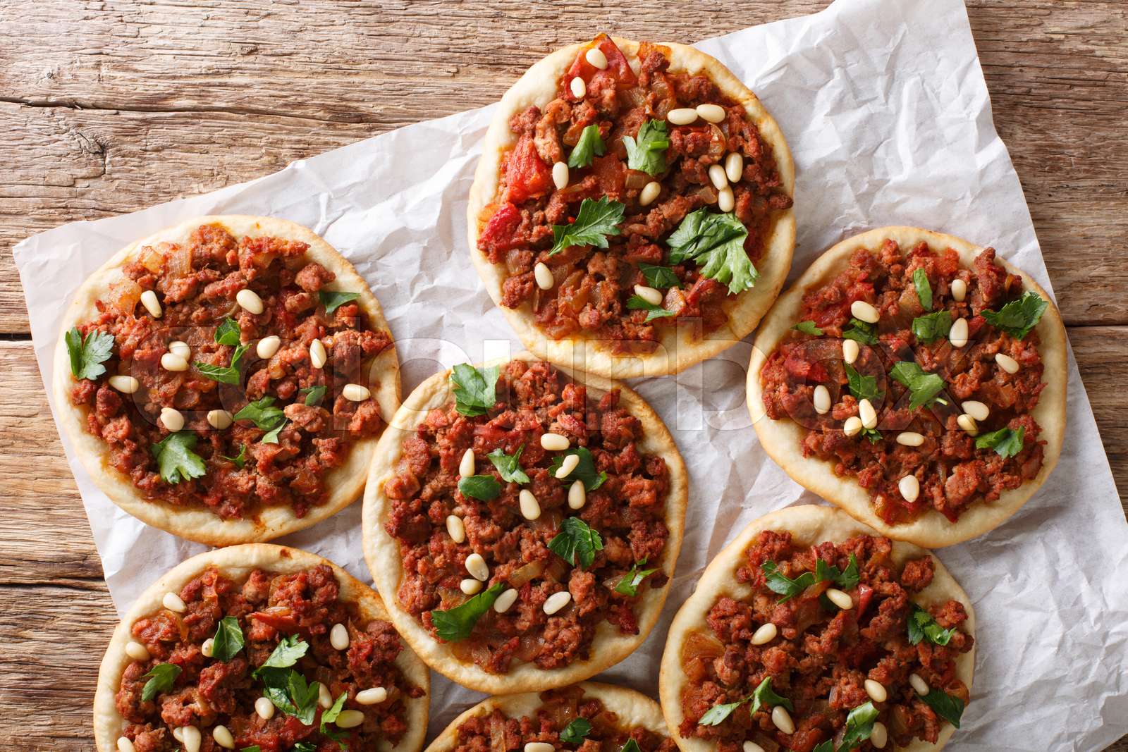 Arab mini pizza with minced meat, tomatoes, onions, spices and pine ...