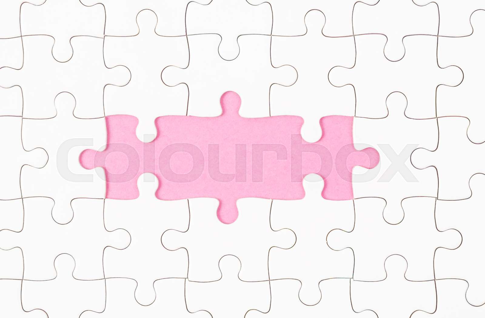 Uncompleted white jigsaw puzzle board. | Stock image | Colourbox