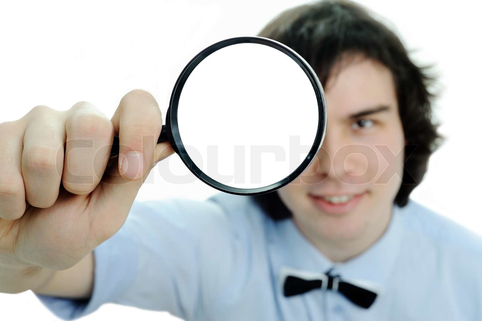 Man with magnifying glass | Stock image | Colourbox