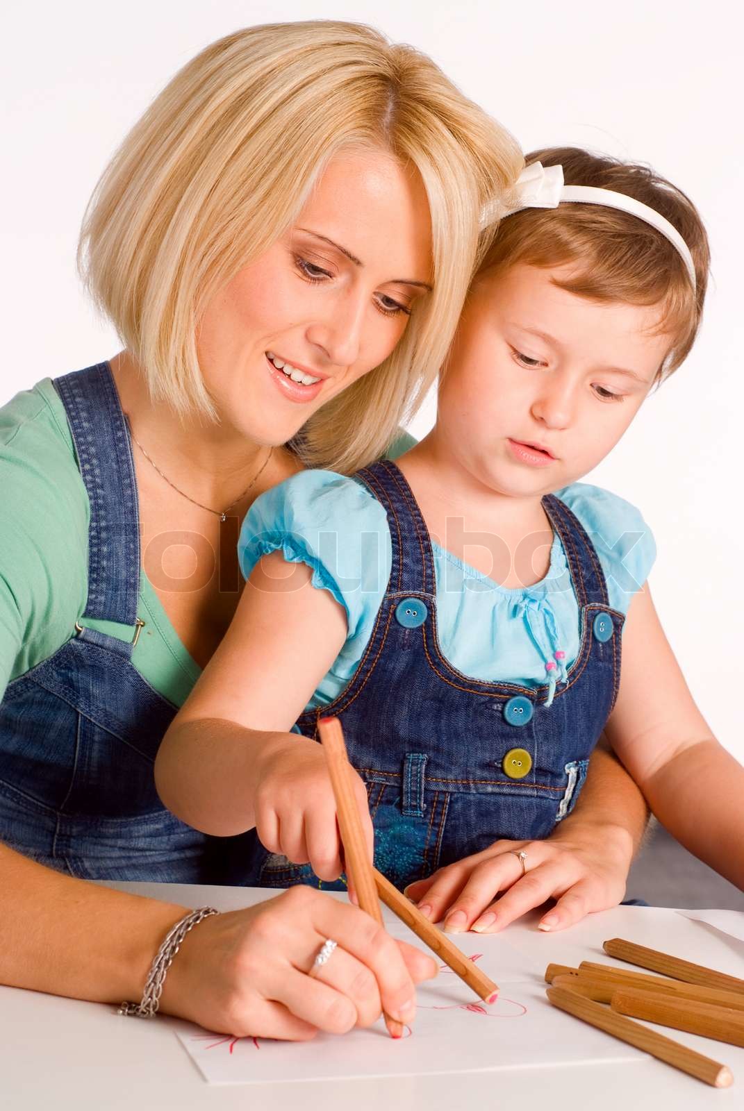 mom and girl drawing | Stock image | Colourbox