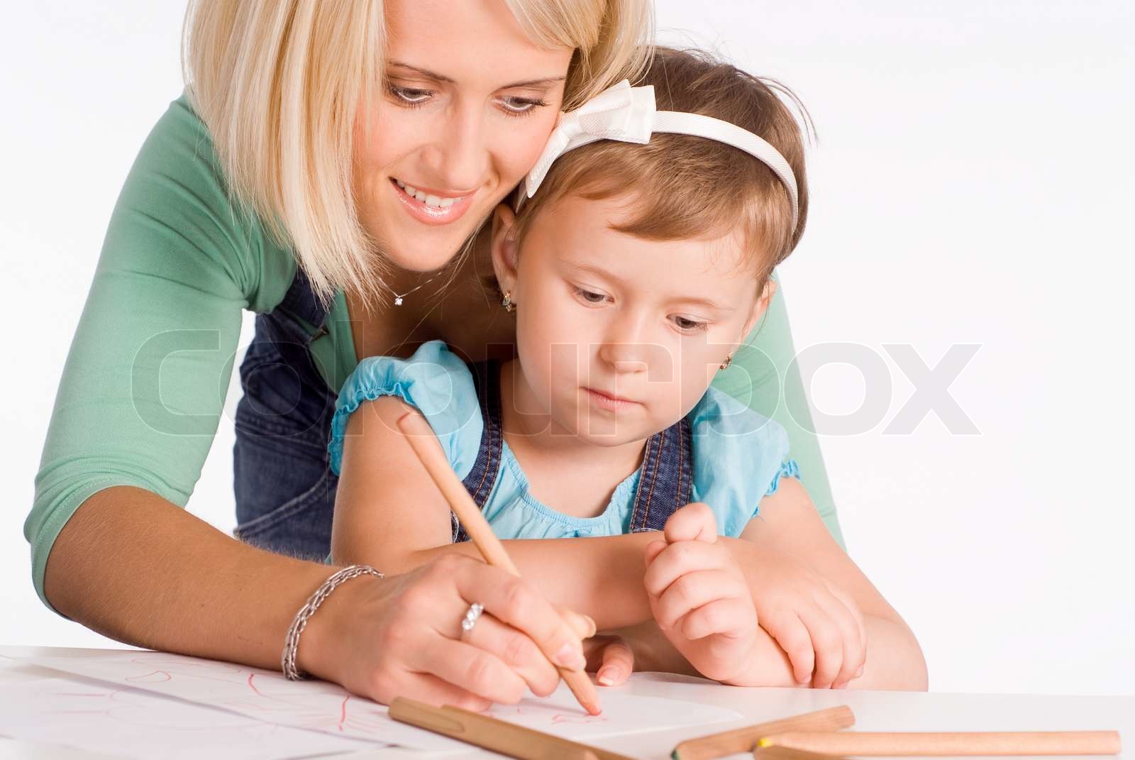 mom draws with her daughter | Stock image | Colourbox