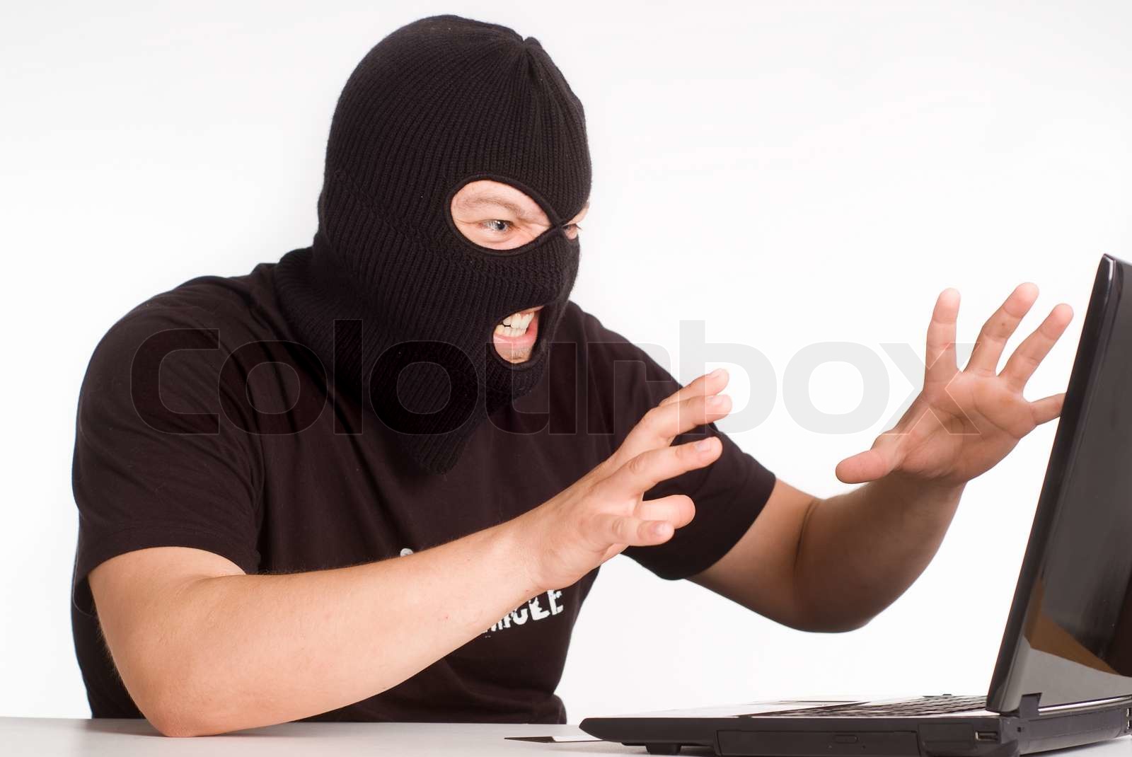 robber with laptop | Stock image | Colourbox