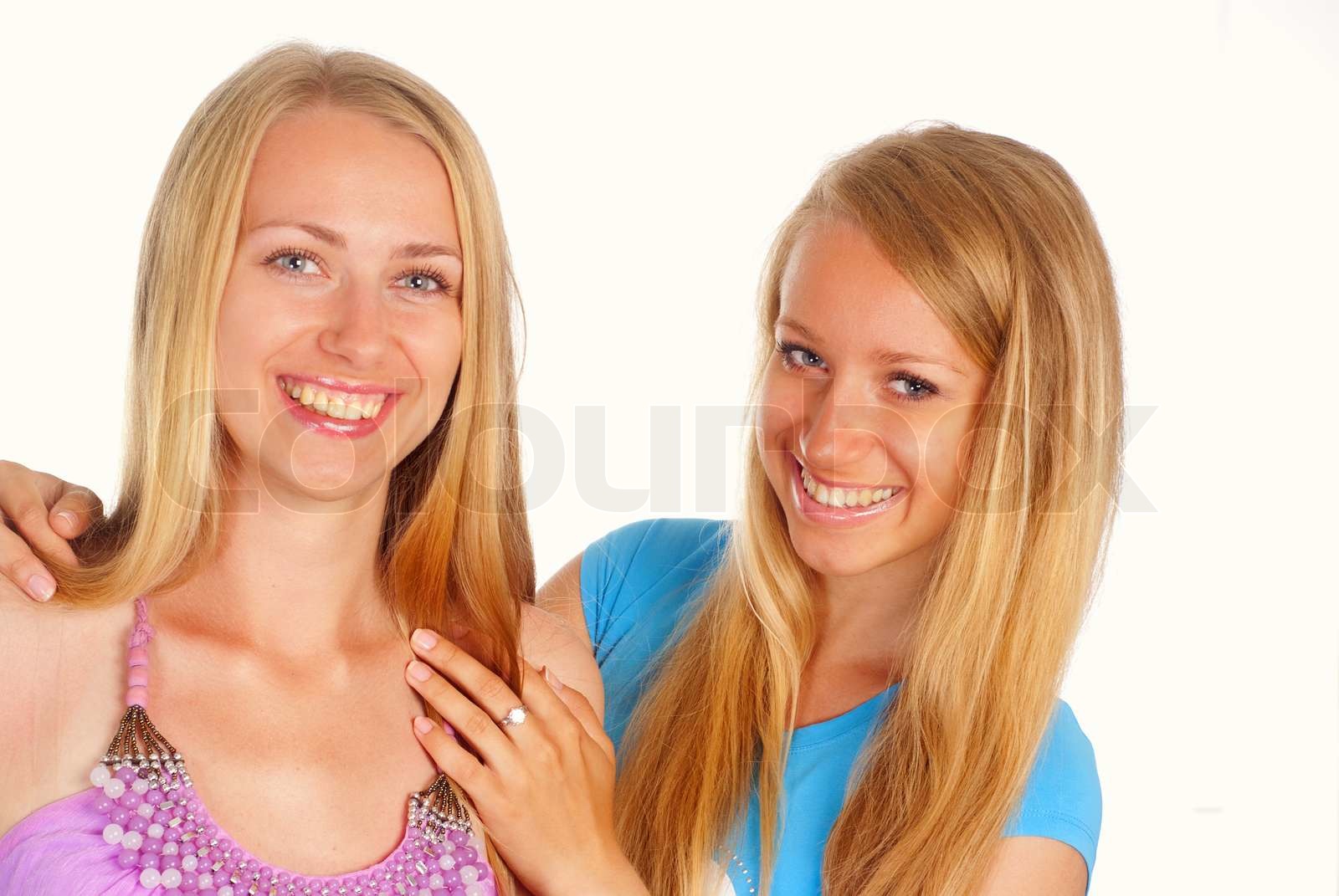 zwei Mädchen auf weißem | Stock Bild | Colourbox