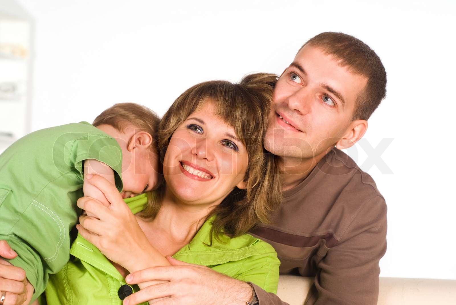 Familie am Sofa | Stock Bild | Colourbox