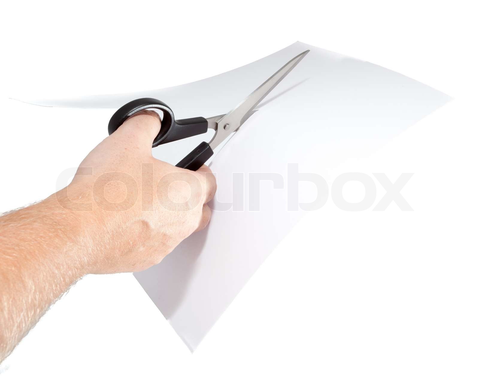 Scissors cutting a paper | Stock image | Colourbox