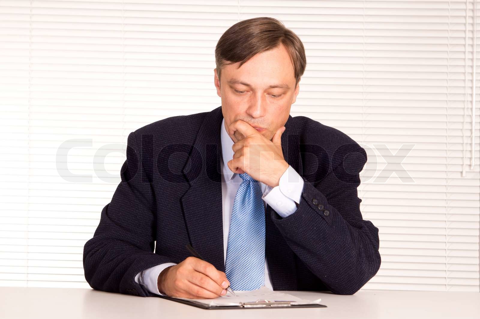 man at table | Stock image | Colourbox