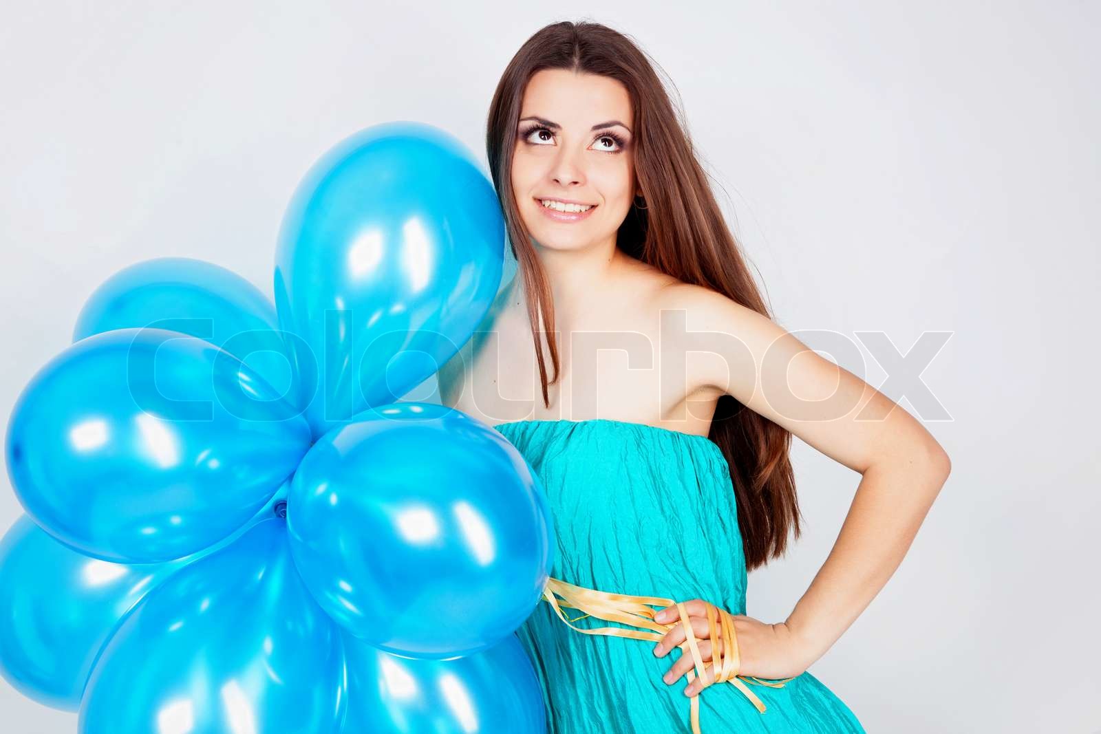 Girl with balloons in studio | Stock image | Colourbox