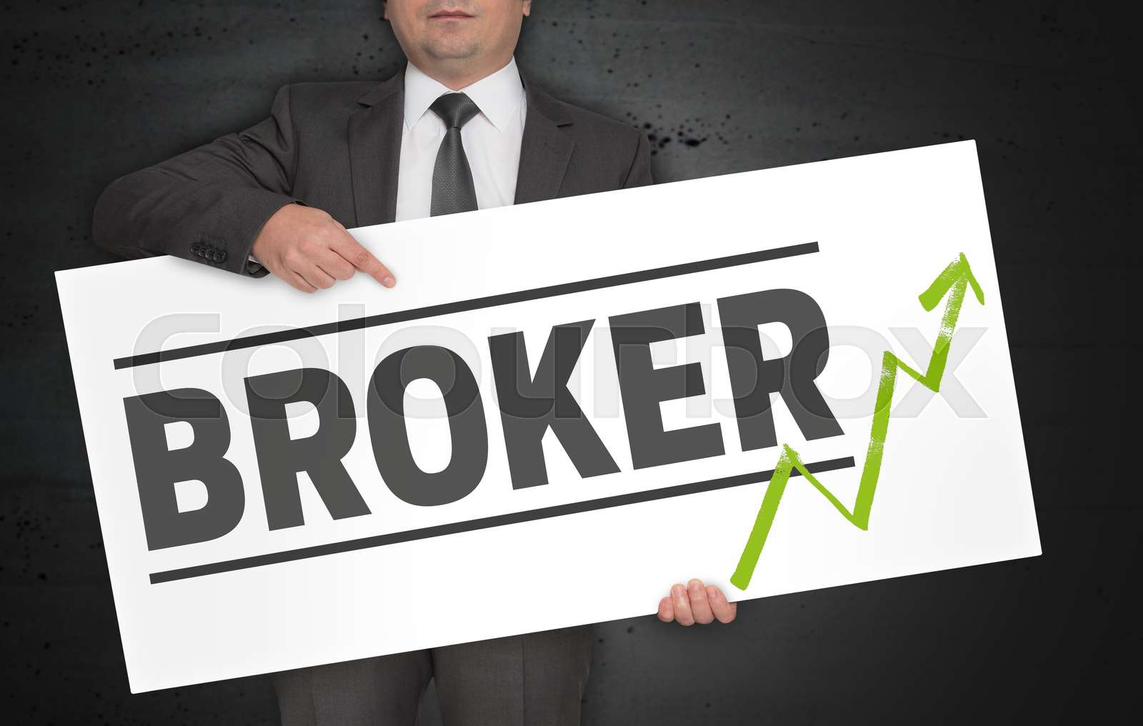 Broker poster is held by businessman | Stock image | Colourbox