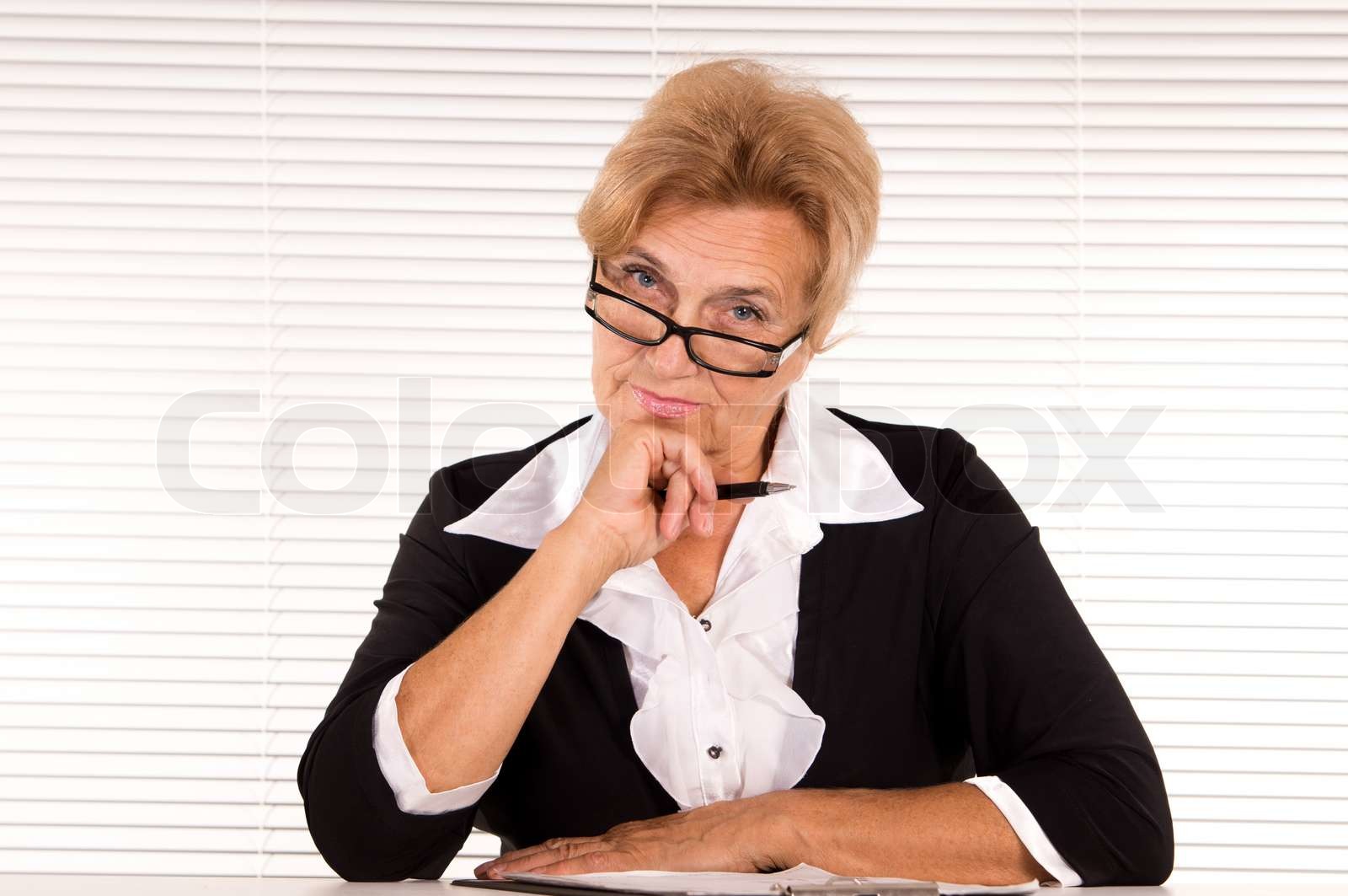old woman at office | Stock image | Colourbox