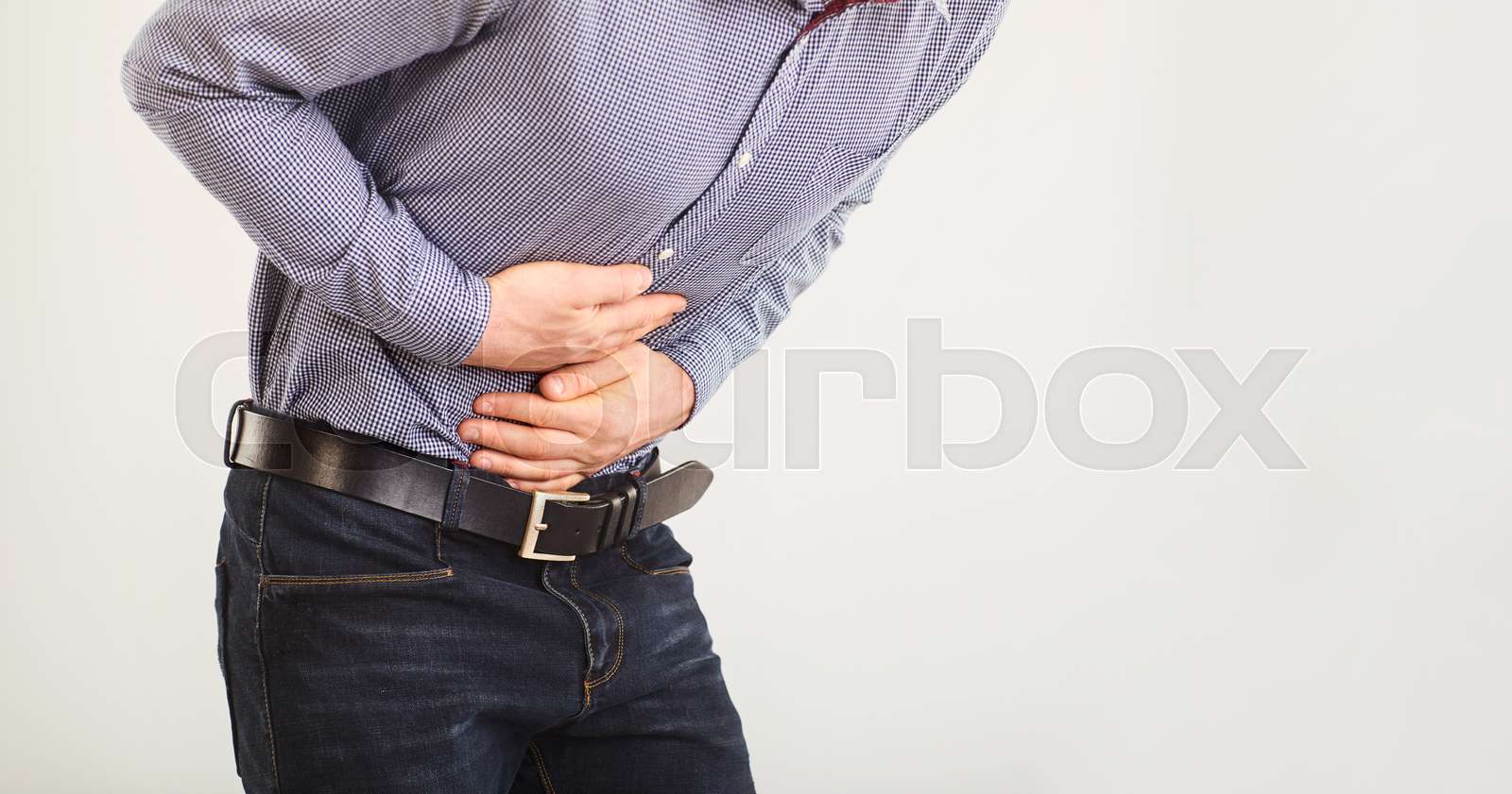 A man suffers from abdominal pain. Abdominal pain. The guy in the ...