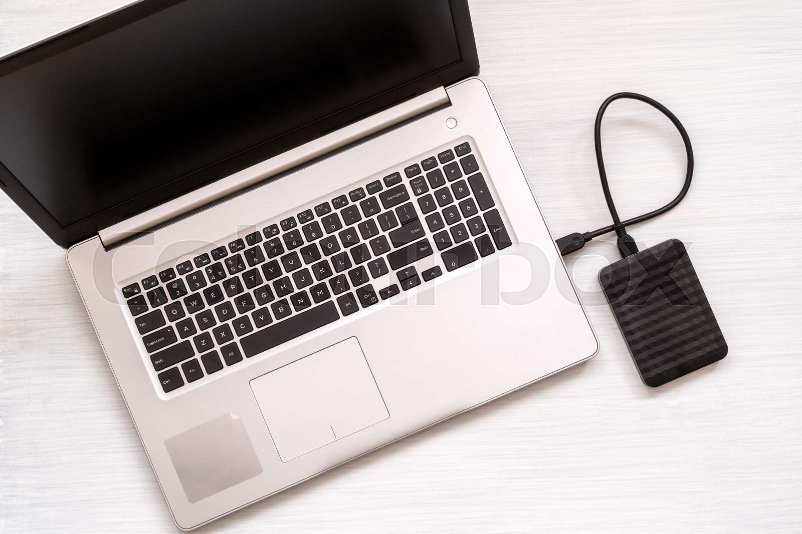 External hard drive connect to laptop | Stock image | Colourbox