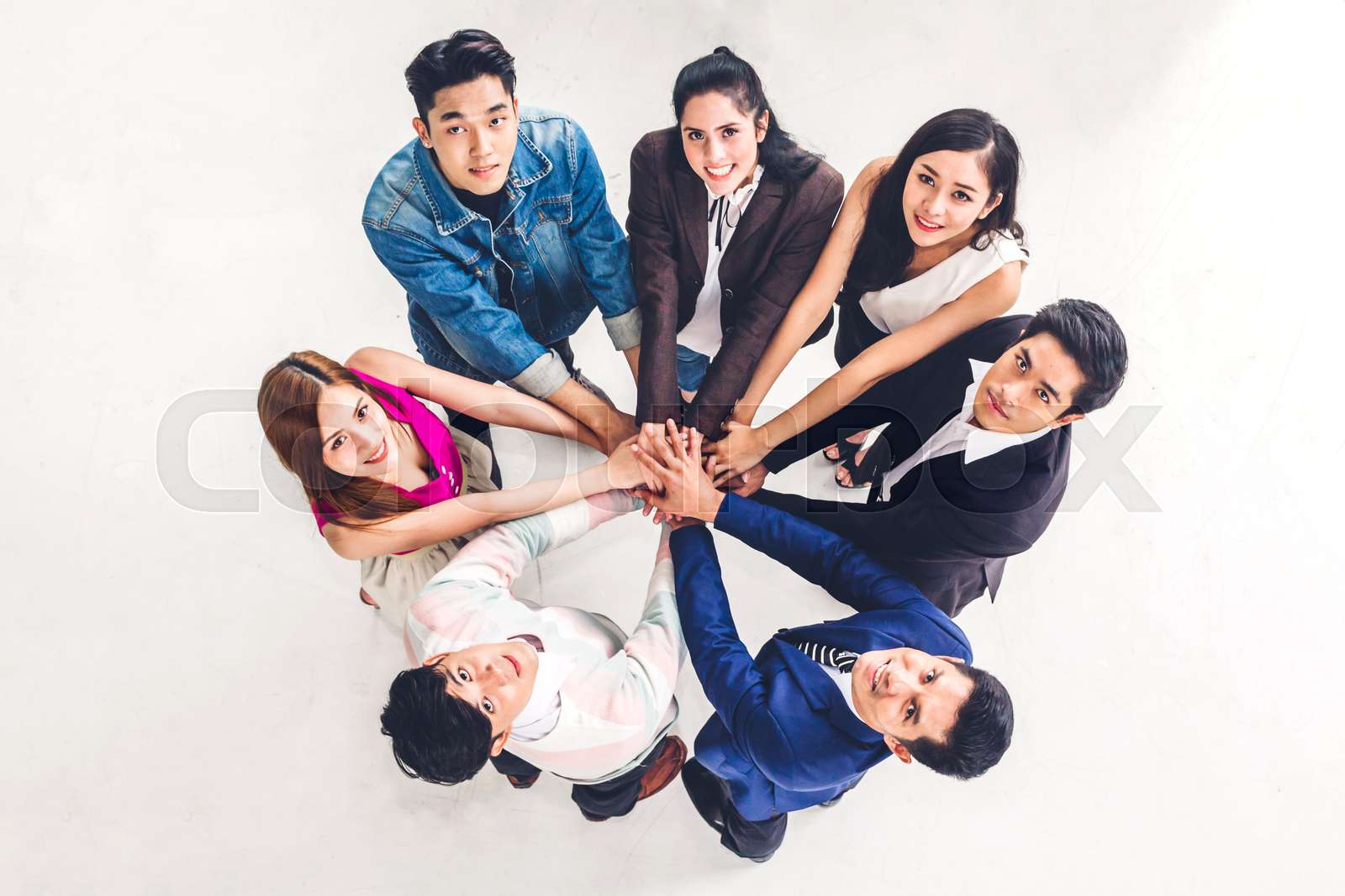 Top view of successful of group business people stack and putting their hands together at office ...