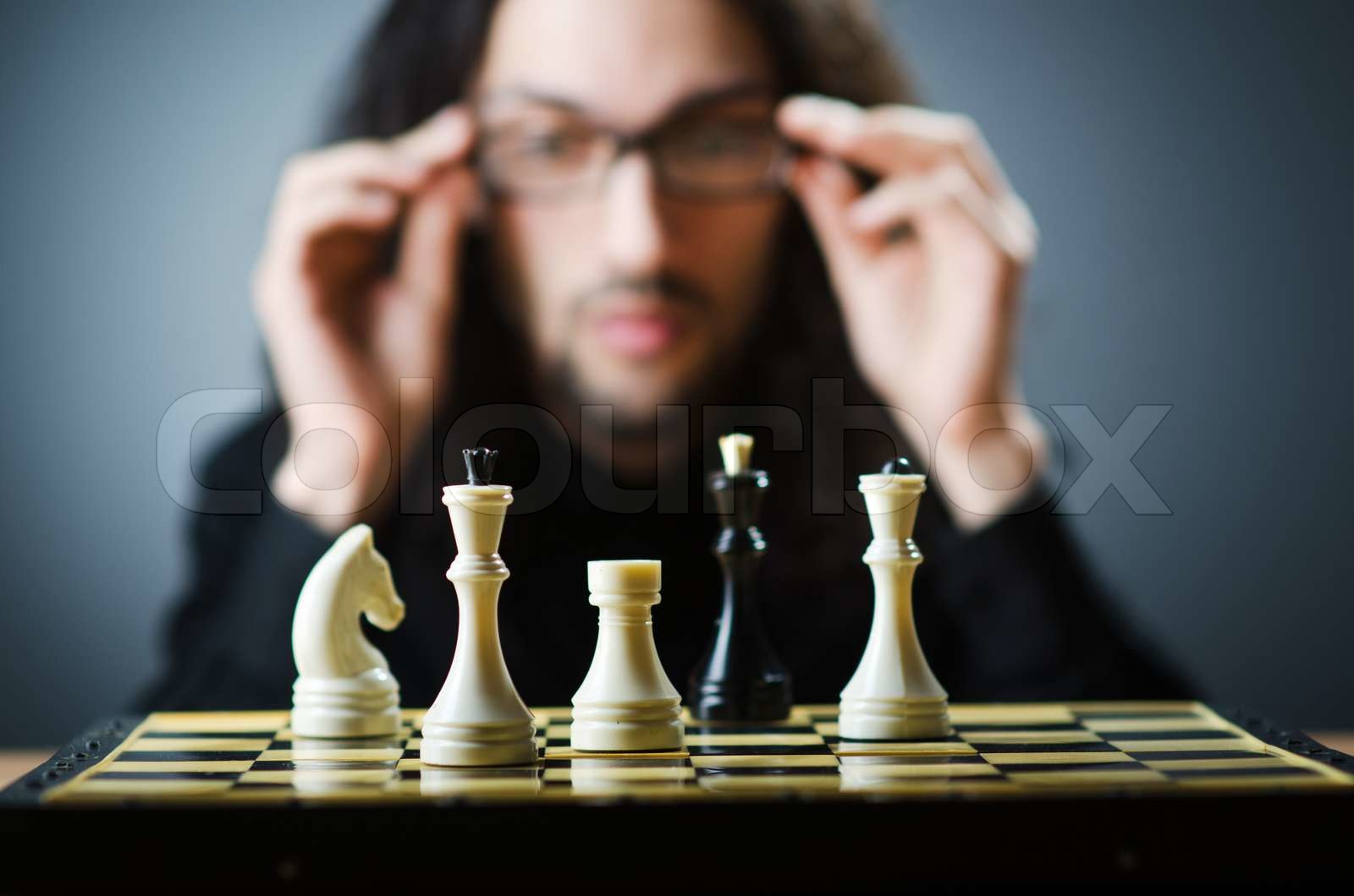 Chess player playing his game | Stock image | Colourbox