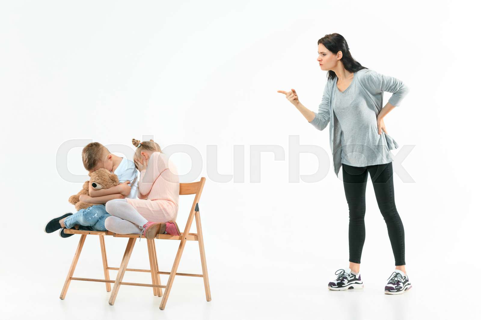 Angry mother scolding her son in living room at home | Stock image ...