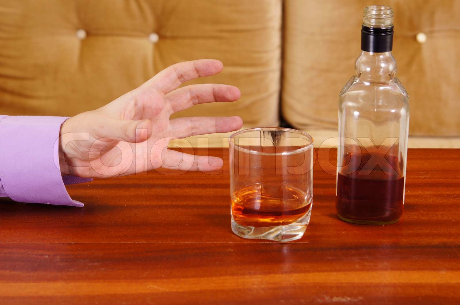hand and whiskey | Stock image | Colourbox