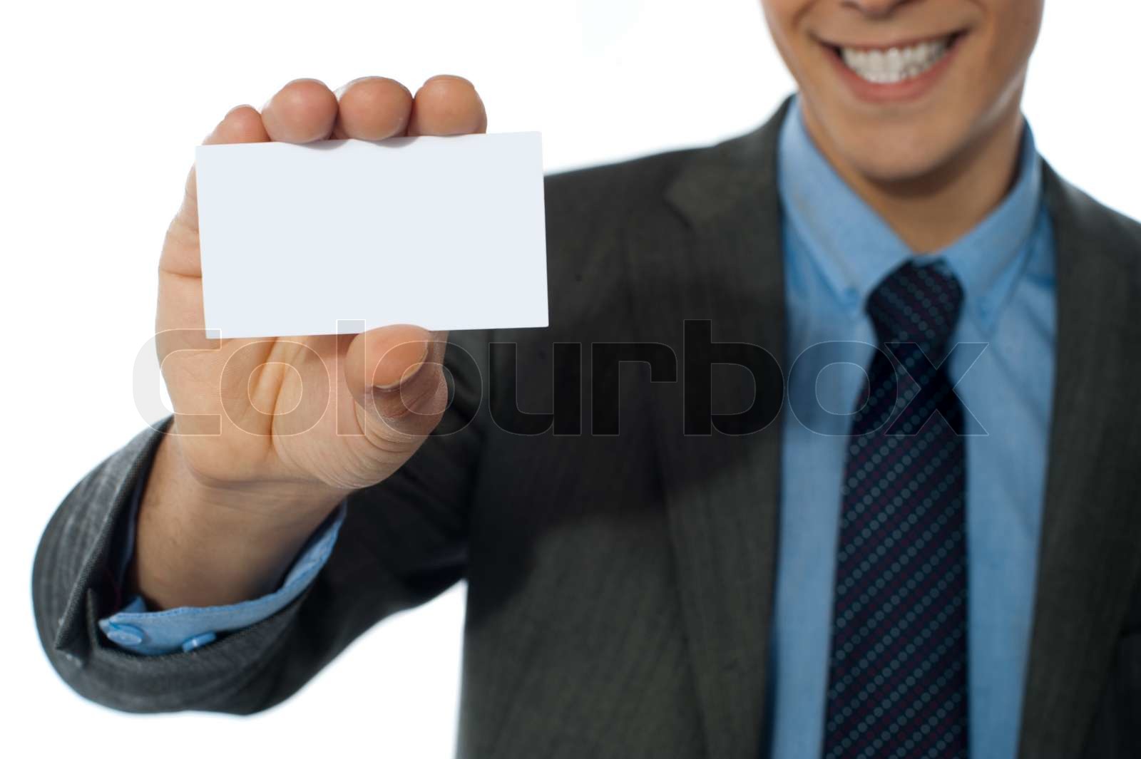 Businessman showing his card | Stock image | Colourbox