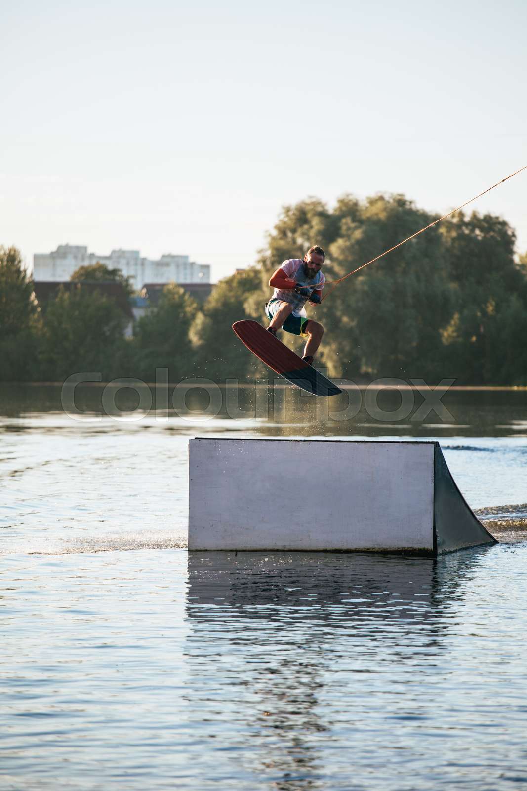 Man riding wakeboard on lake | Stock image | Colourbox
