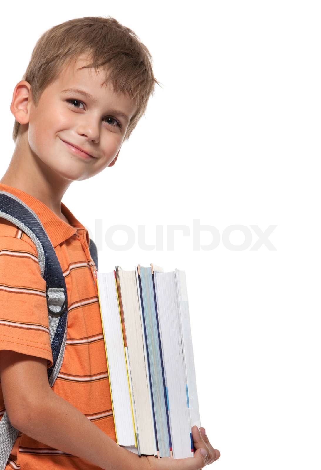 Boy holding books | Stock image | Colourbox