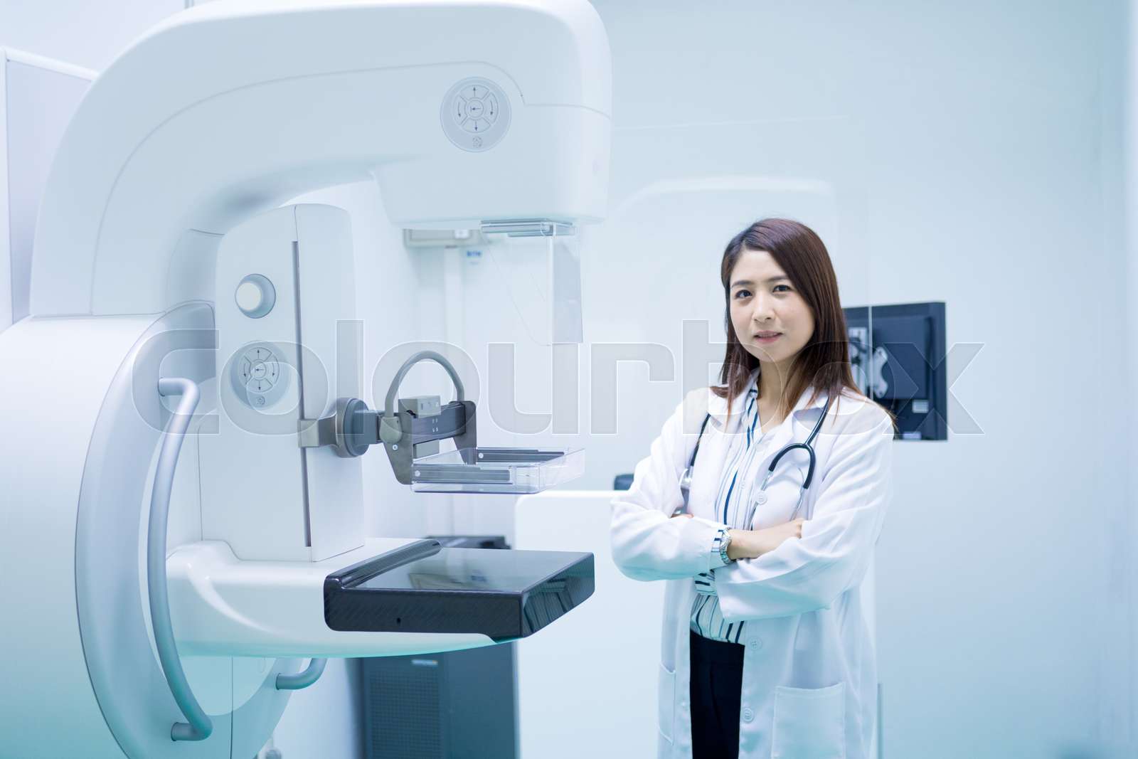 Smart doctor with CT scan machine. | Stock image | Colourbox